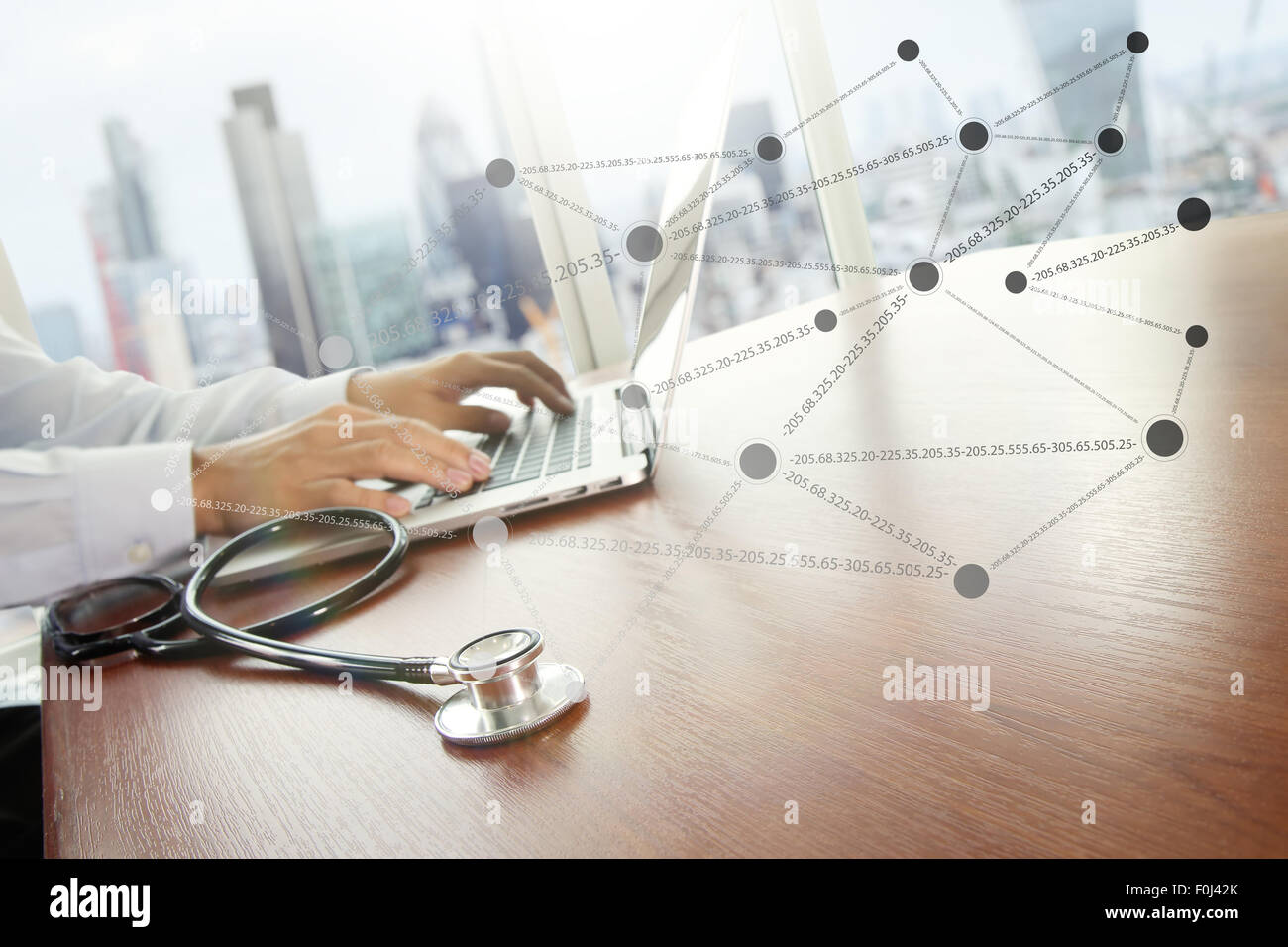 Doctor working with laptop computer in medical workspace office and ...