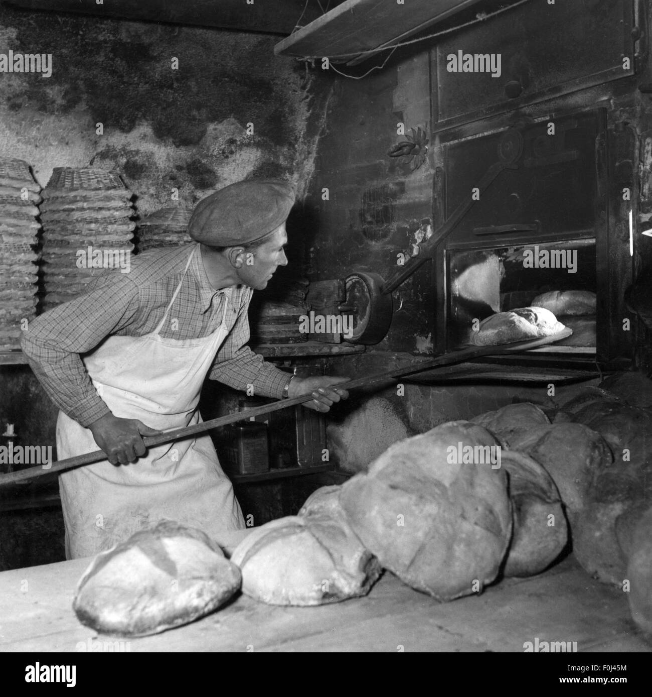 people, professions, baker, putting a bread loaf in the oven, St ...