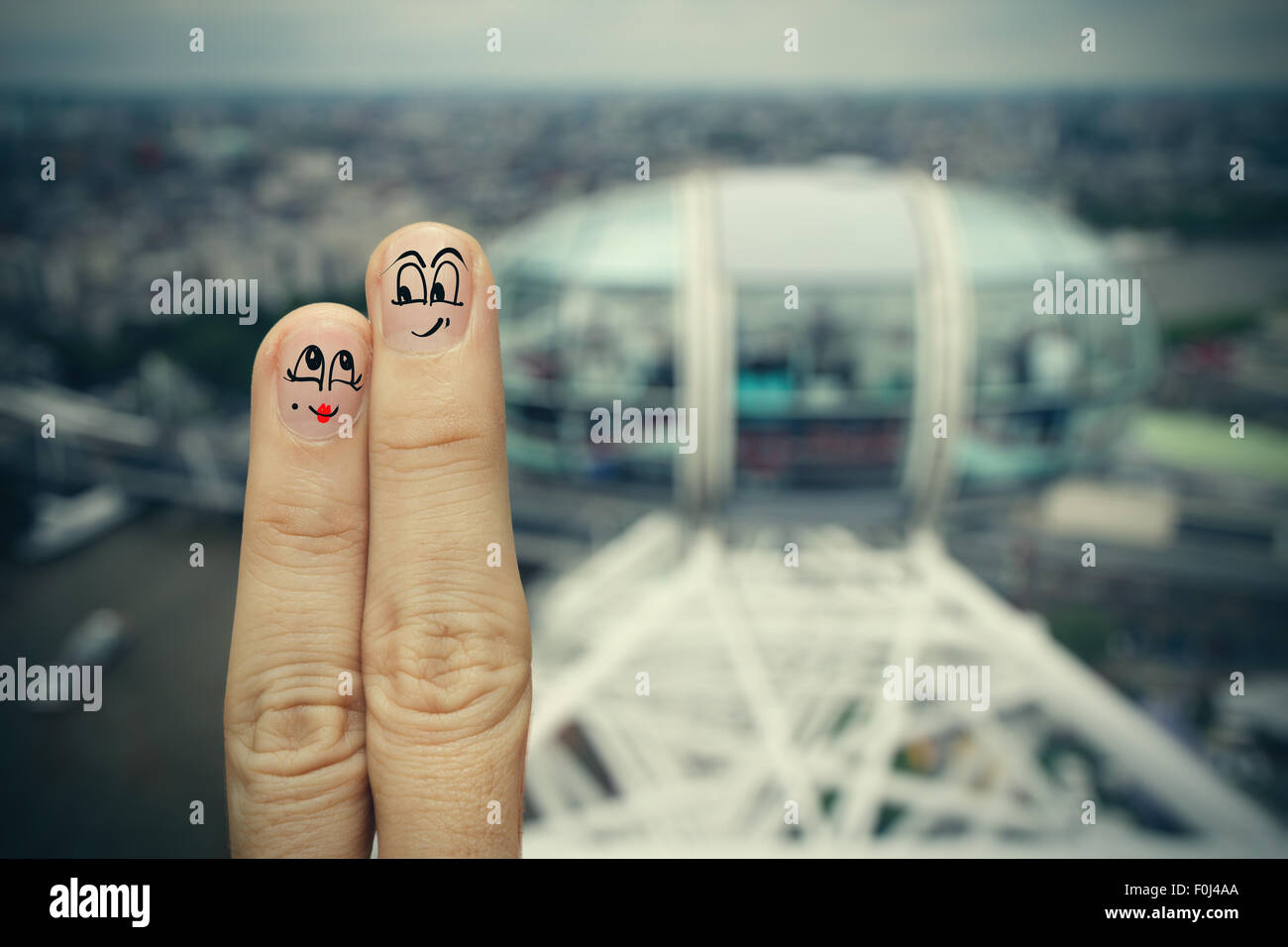 the happy finger couple in love with painted smiley on london city ...