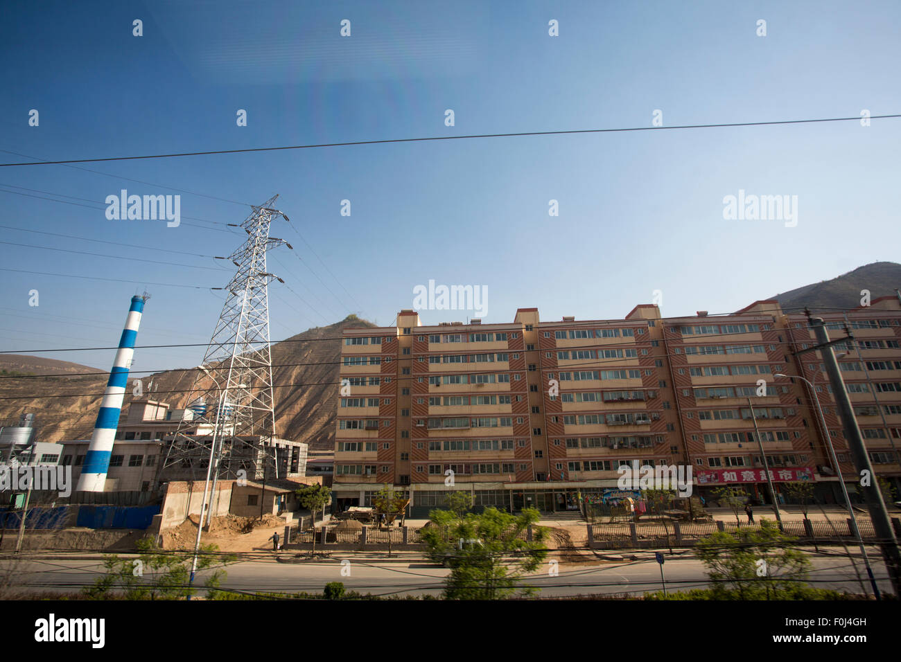 Factory and residential buildings along the train line in the North ...