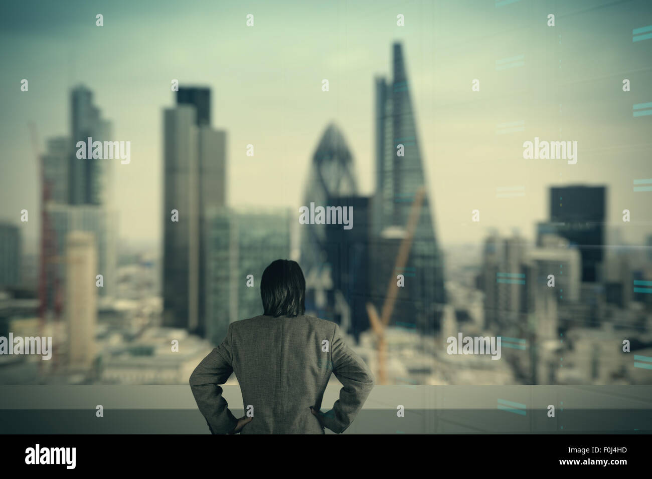 businessman stands successfully on building top Looking Towards the ...