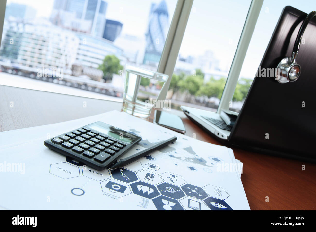 Doctor workspace with laptop computer in medical workspace office and ...