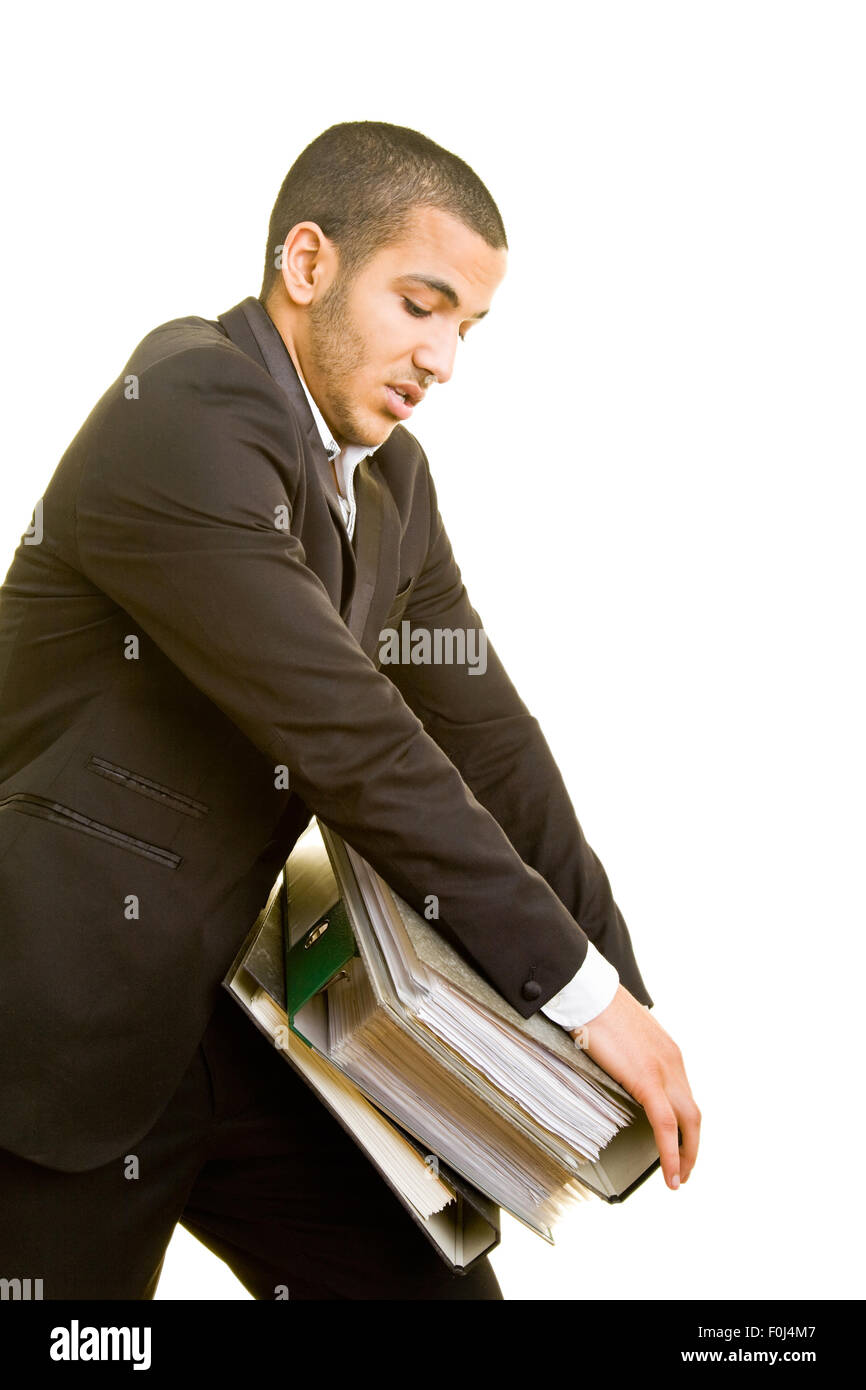 Stressed young business man carrying heavy files Stock Photo - Alamy