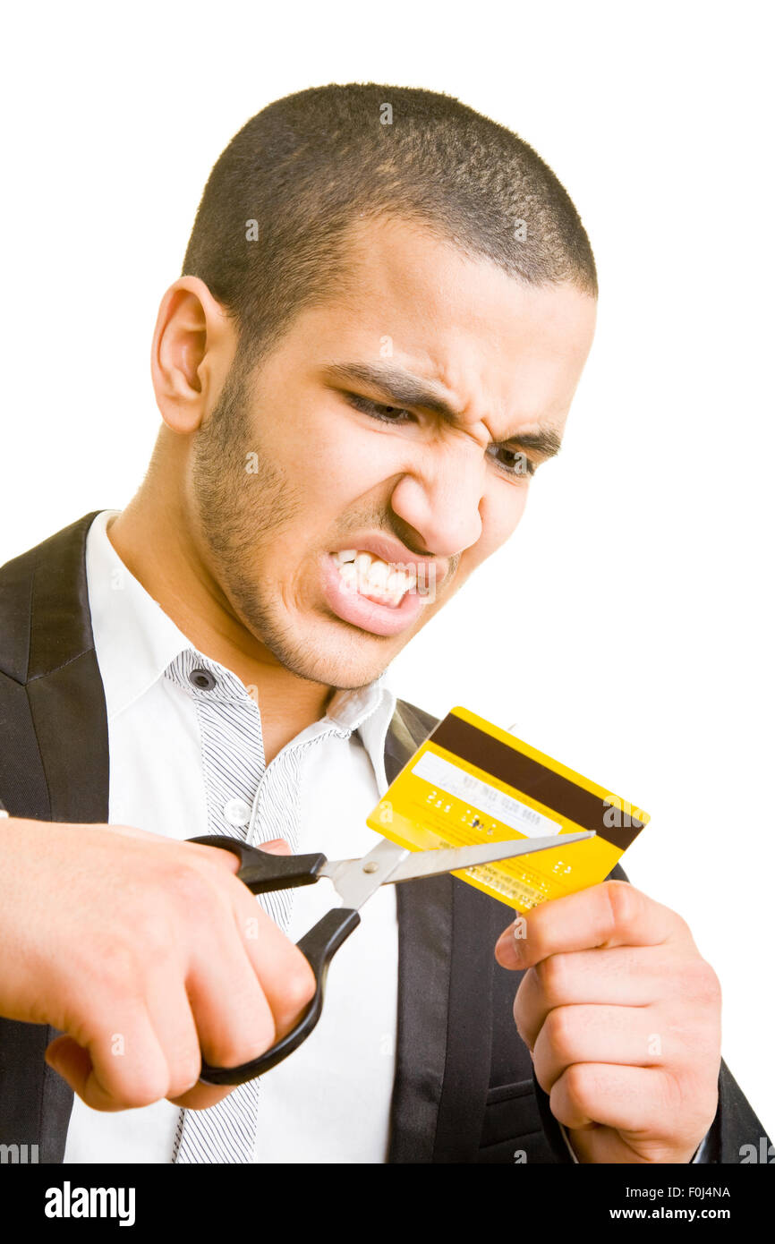 Angry business man cutting his credit card with scissors Stock Photo ...