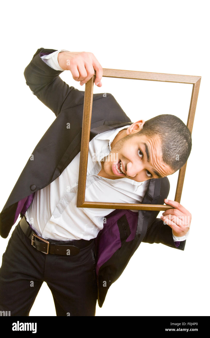 Young manager falling through an empty picture frame Stock Photo - Alamy