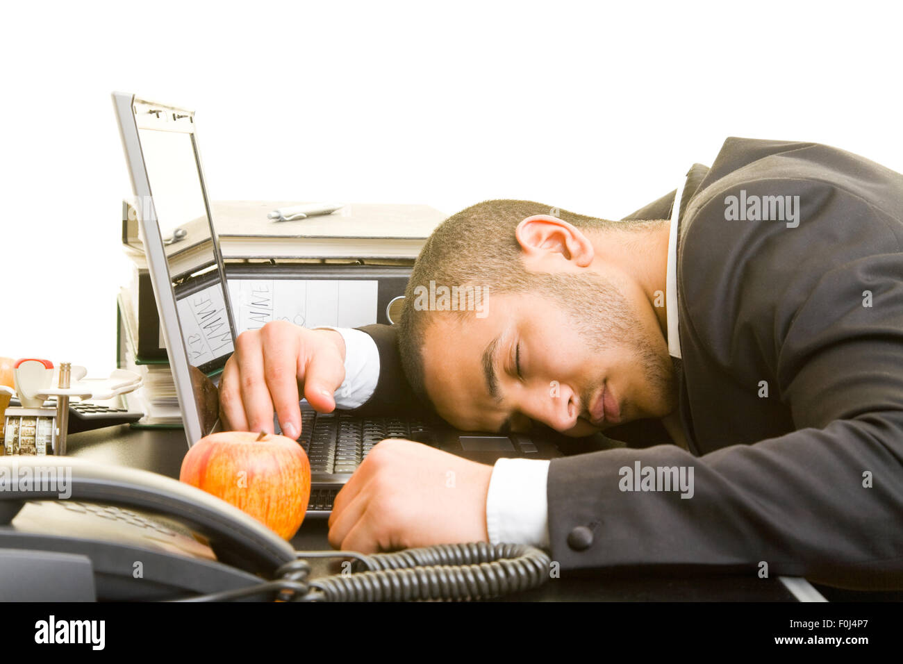Business man sleeping at work with head on his laptop Stock Photo - Alamy