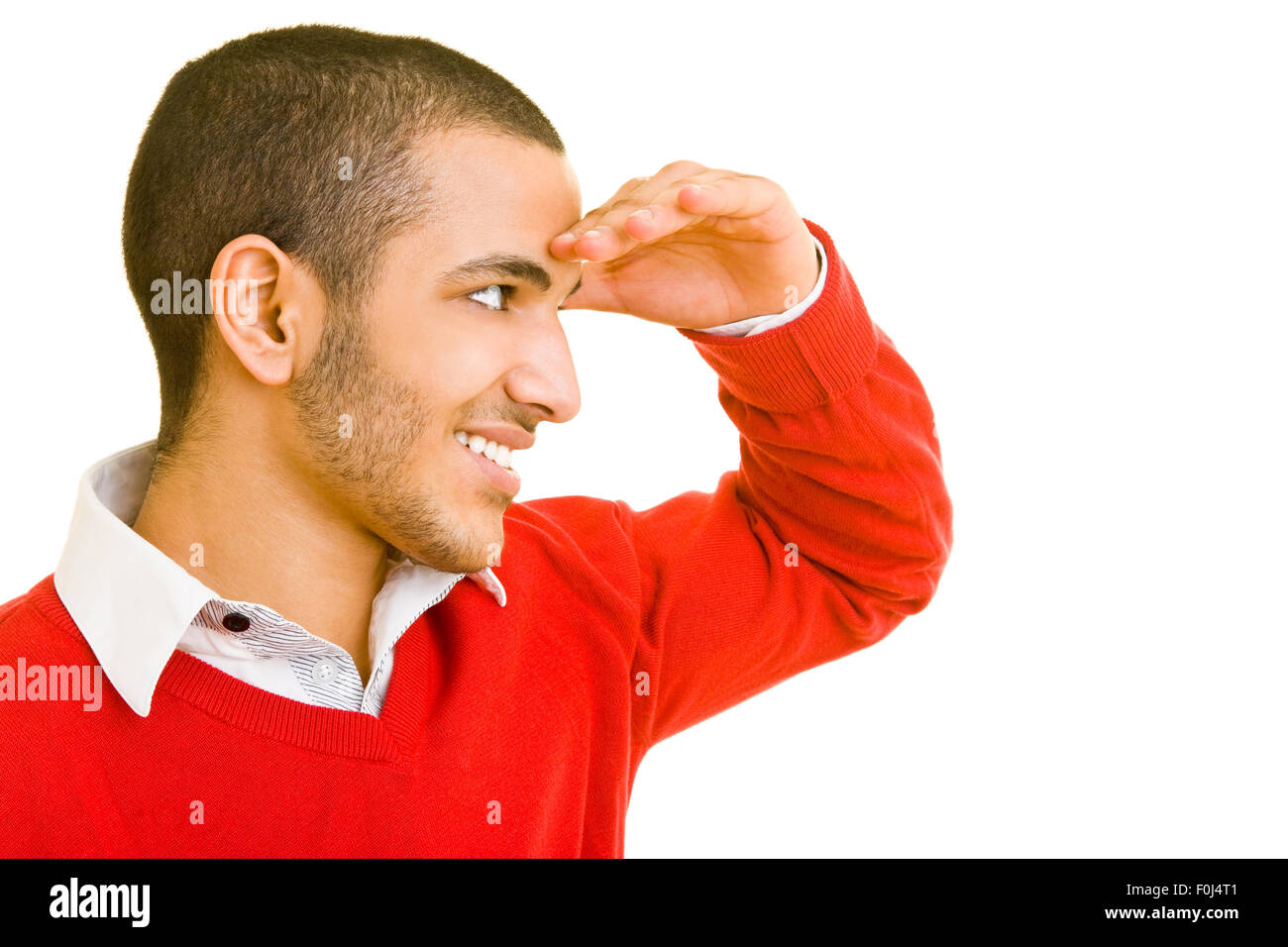 Young man looking into the distance with hands over his eyes Stock ...