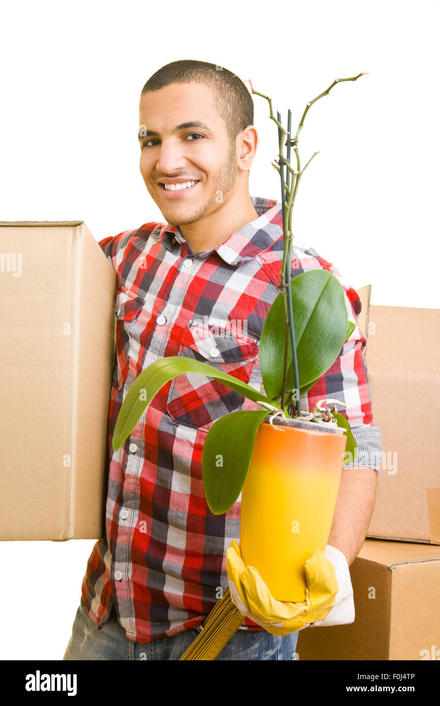 Man with plant and cardboard box helping moving house Stock Photo - Alamy