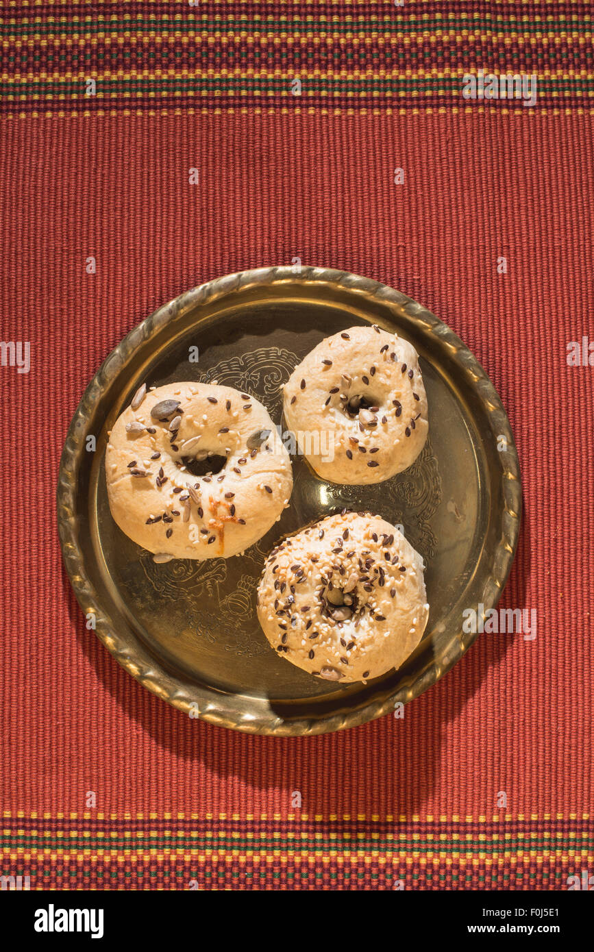 Bagels on a vintage table. Old vintage pan Stock Photo - Alamy