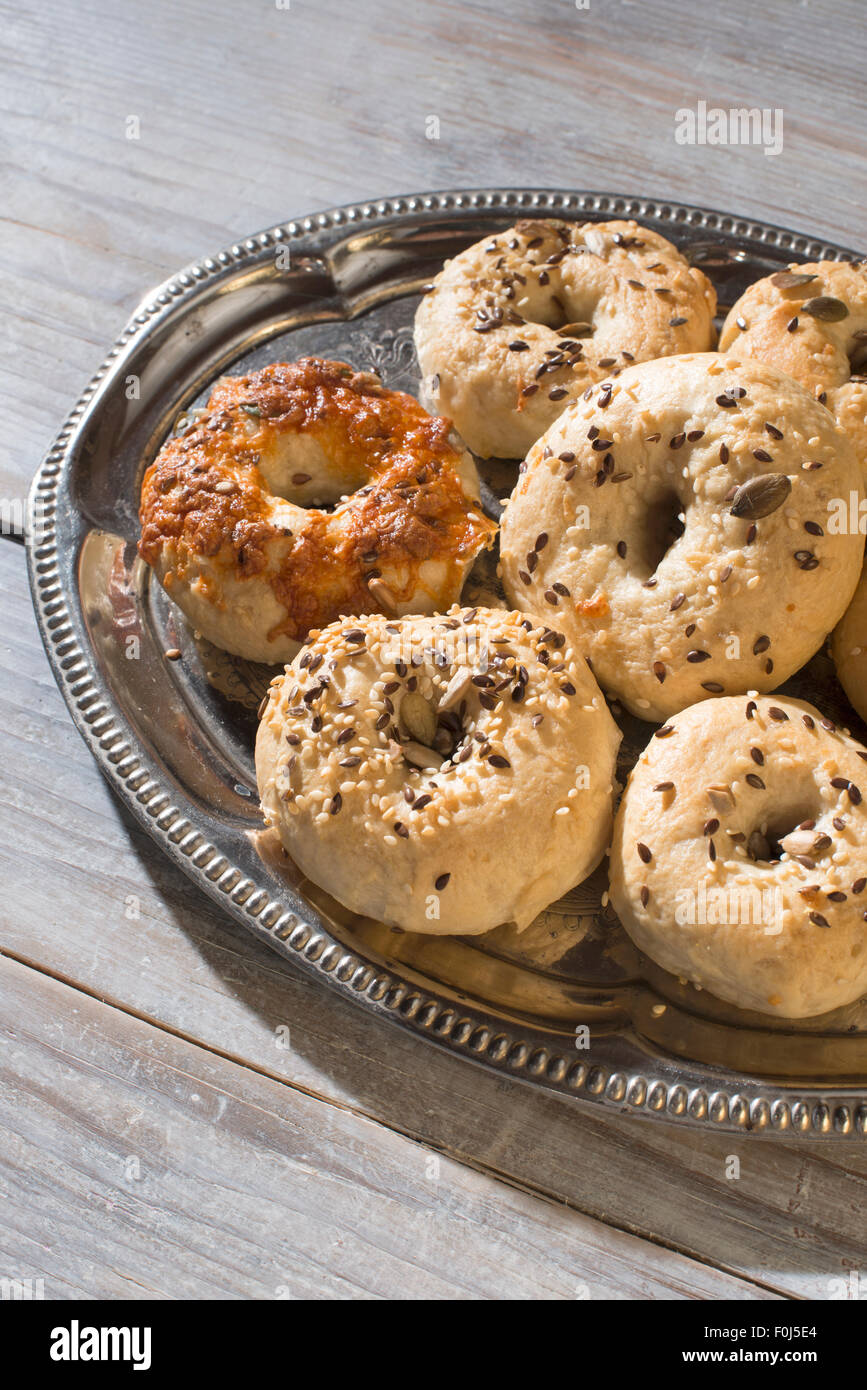 Bagels on a vintage table. Old vintage pan Stock Photo - Alamy