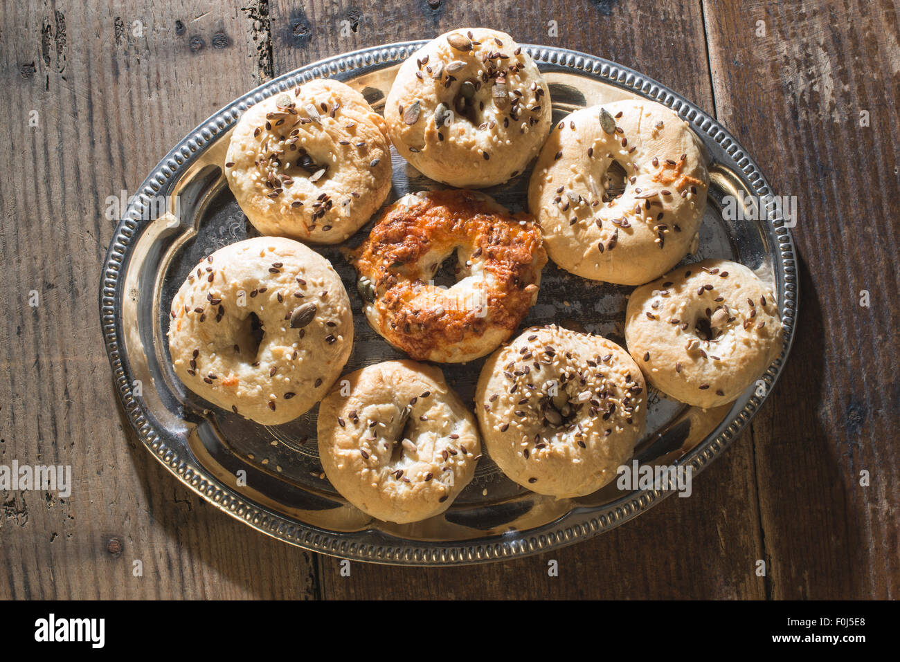Bagels on a vintage table. Old vintage pan Stock Photo - Alamy