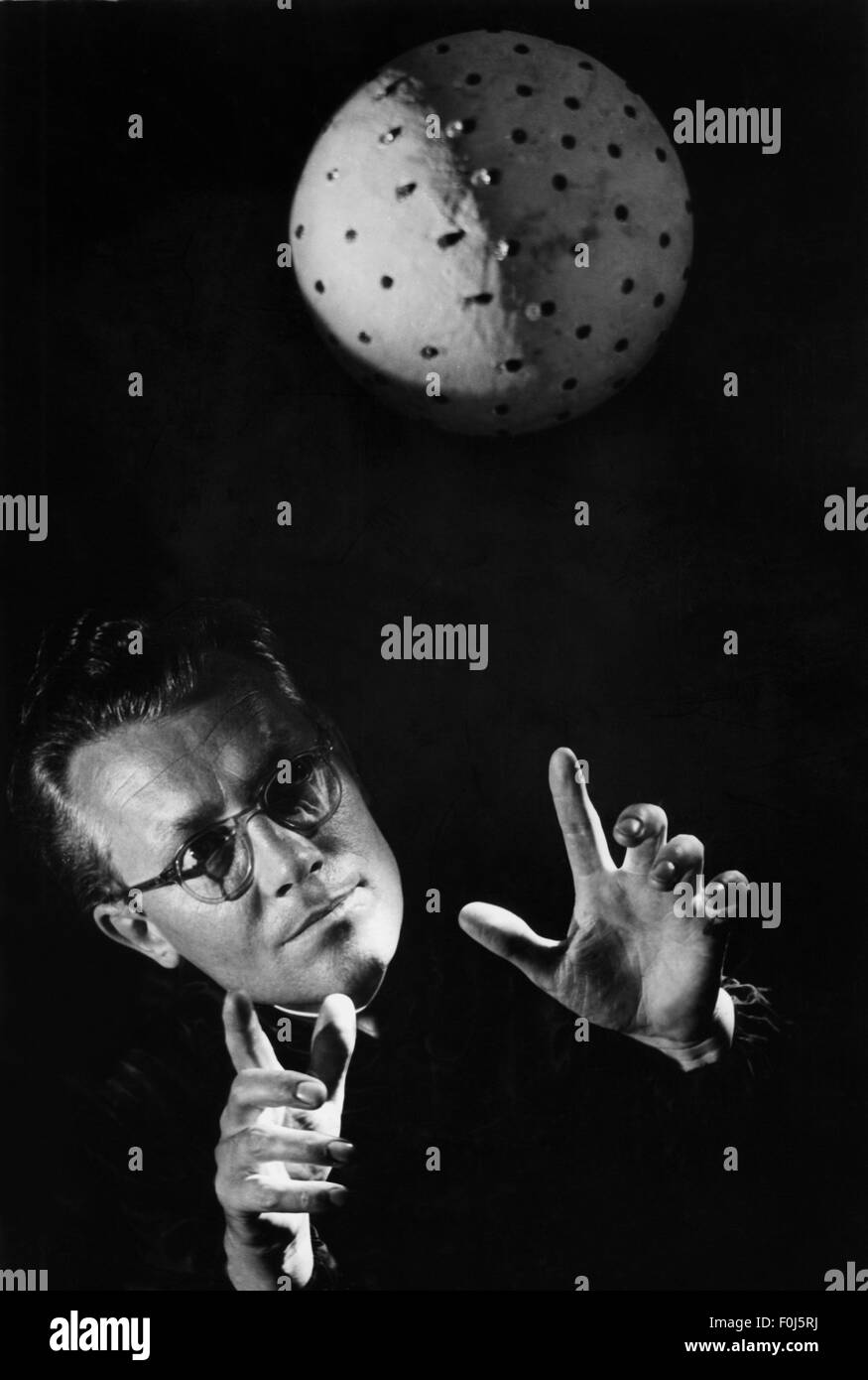 Magician levitating ball 1960s hi-res stock photography and images - Alamy
