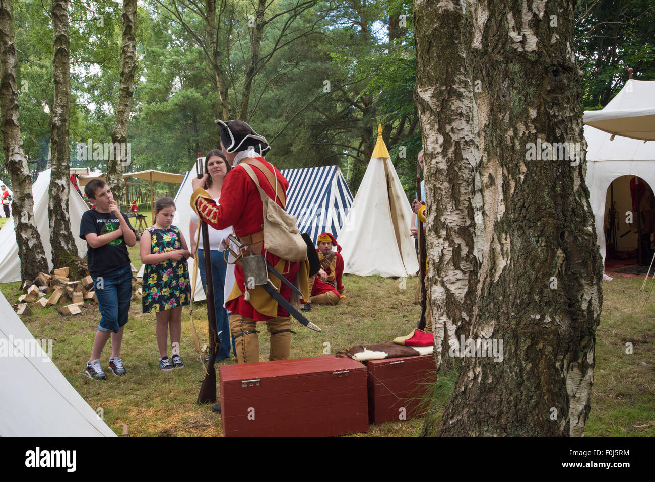 French military soldiers talking to children during an 18th Century ...