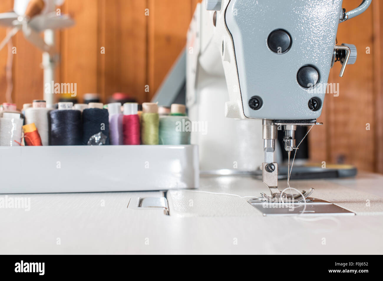 Woman sewing on a sewing machine. Close up Stock Photo - Alamy