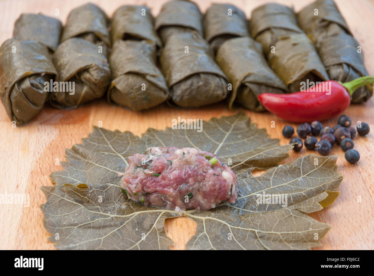 cooking of dolma from pickled grape leaves, minced meat and rice with ...