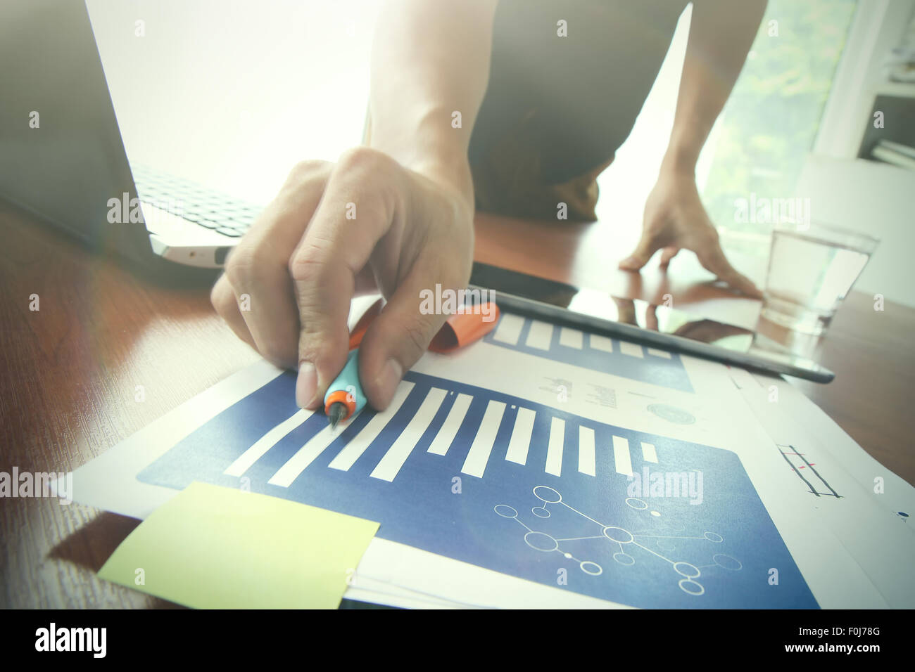 Young creative designer man picking up the pen at office and social ...