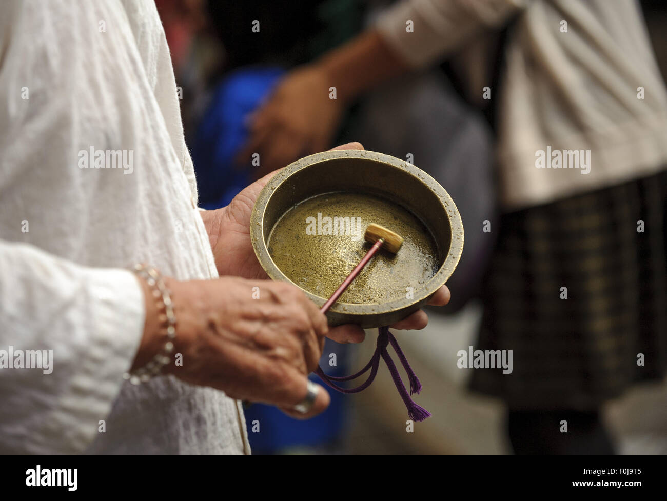 Fujisawa, Kanagawa, Japan. 17th Aug, 2015. A man plays a Japanese bell ...