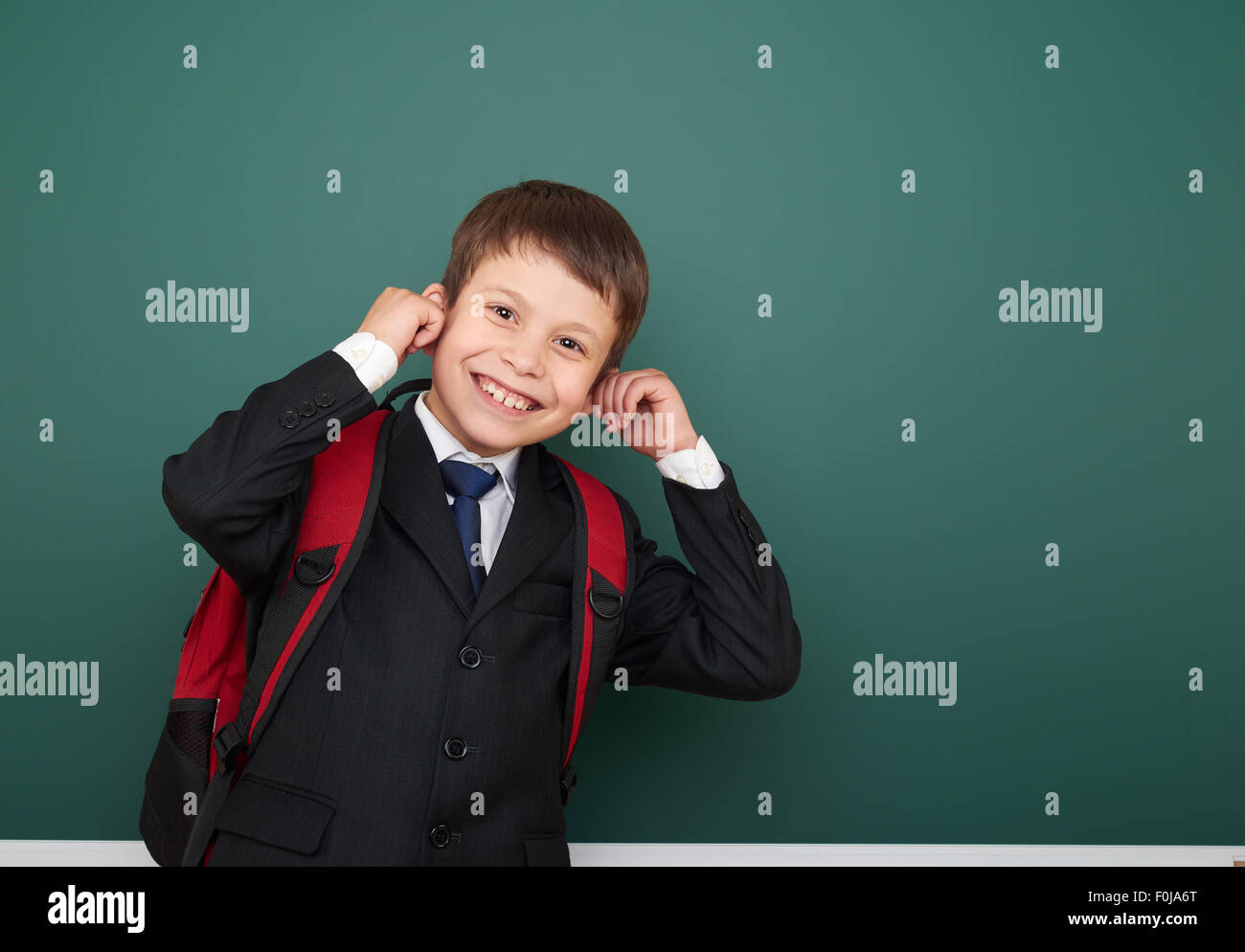school boy portrait on board background Stock Photo - Alamy