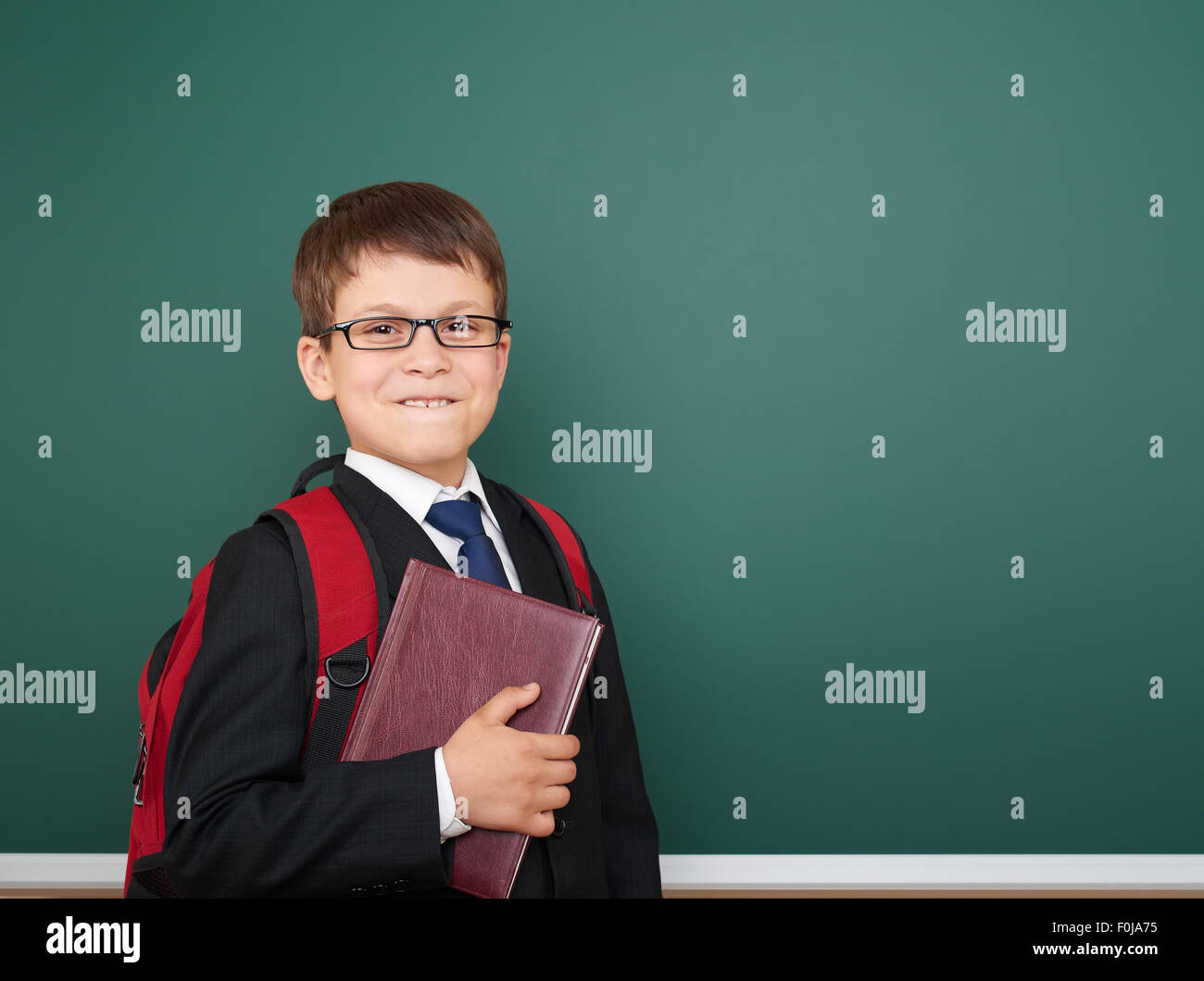 school boy portrait on board background Stock Photo - Alamy