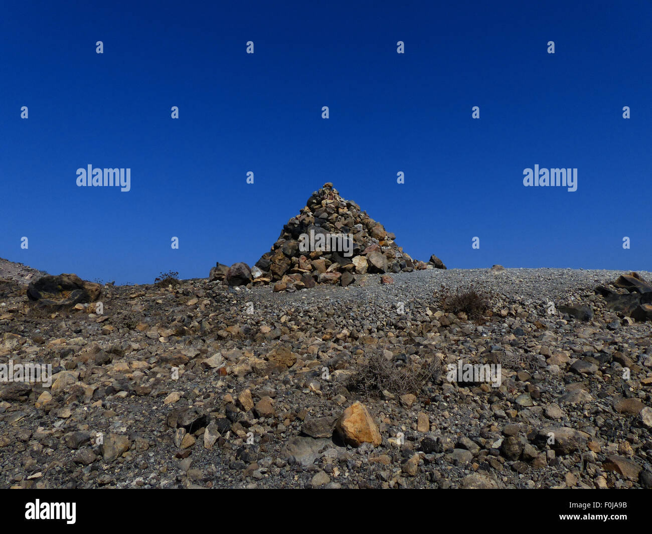 Stone piles or cairns on volcanic Nea Kameni Island Greece Stock Photo ...