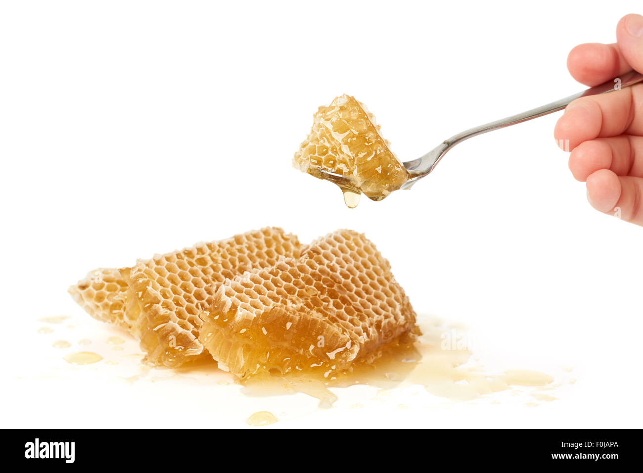 Woman wants to taste raw honey. Isolated on white Stock Photo - Alamy
