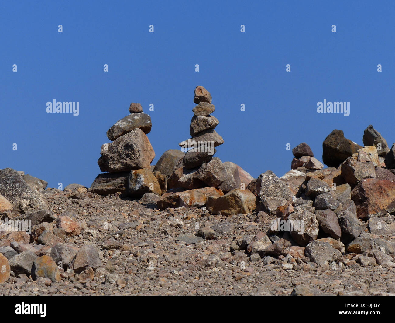 Stone piles or cairns on volcanic Nea Kameni Island Greece Stock Photo ...