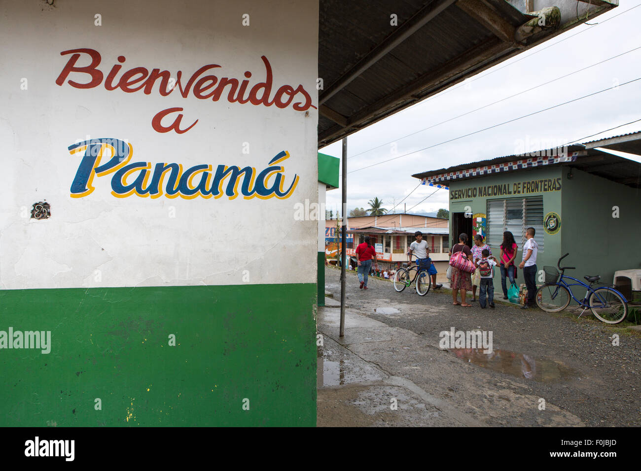 Sign welcome in Panama painted on a white and green wall at Sixaola ...