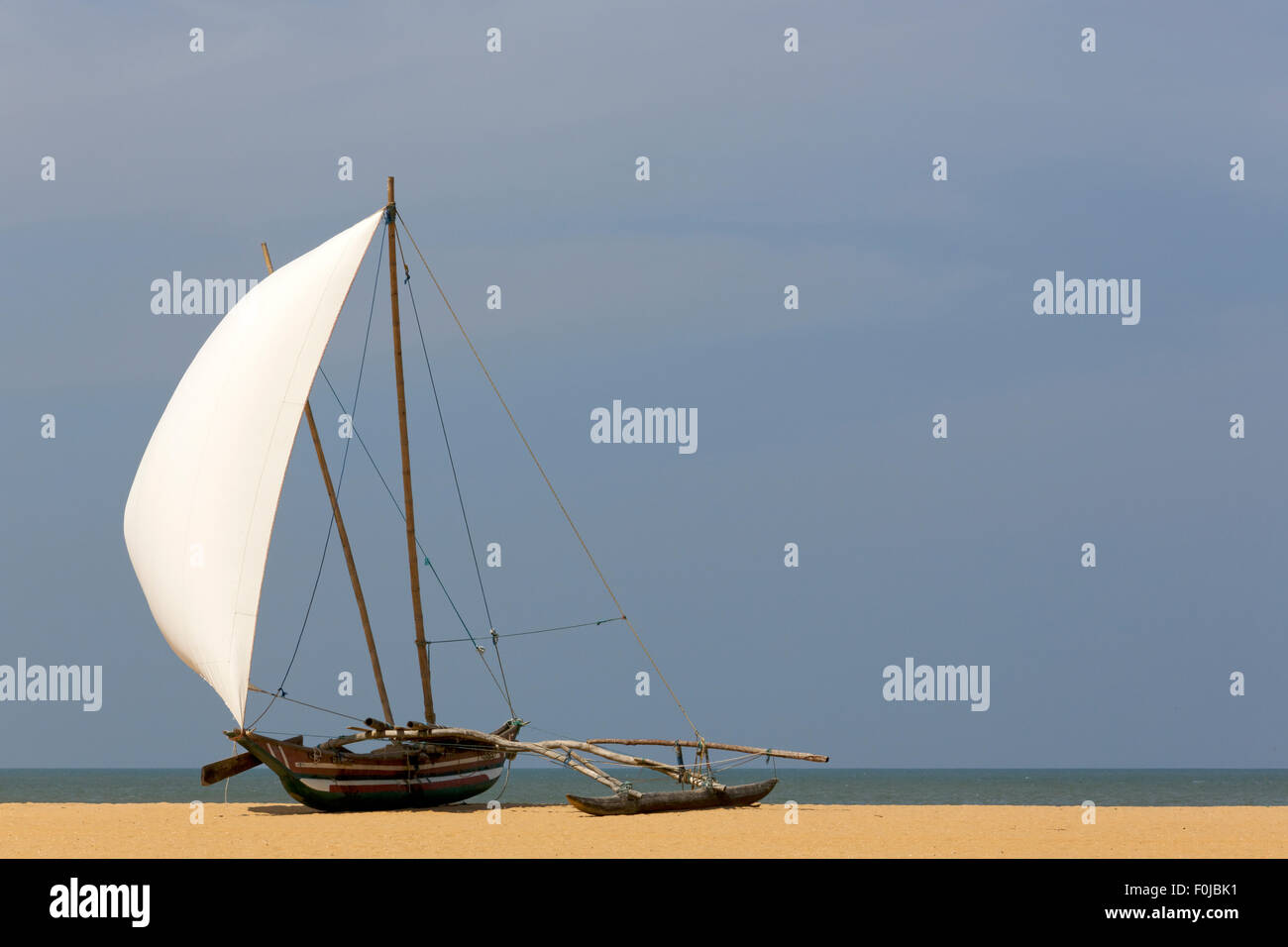 An oruwa - traditional outrigger of Sri Lankan fishermen - with its ...