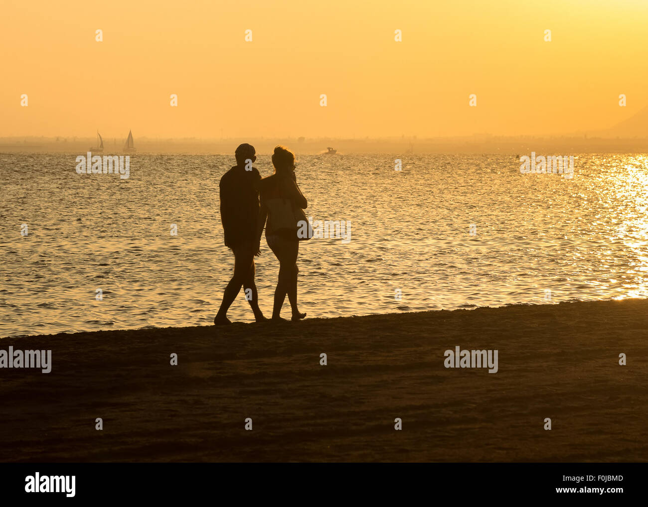 Couple and stroll and beach a hi-res stock photography and images - Alamy