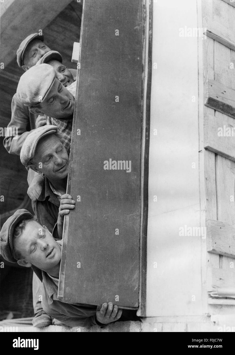 people, occupation, carpenter, five men fitting a plank, 1950s ...
