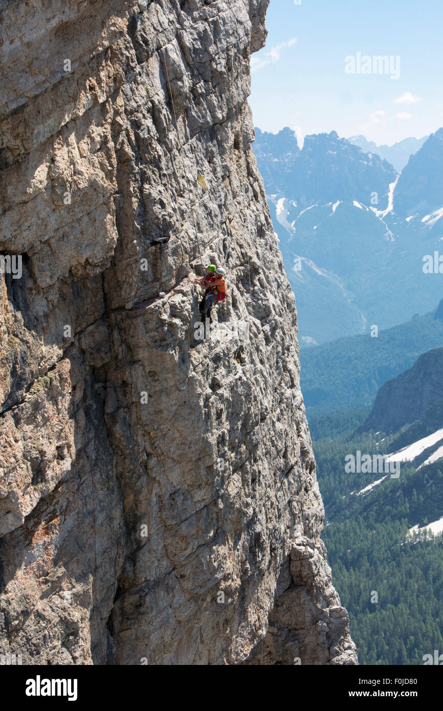 Mountain rescue team members in action in the mountains of Dolomites ...