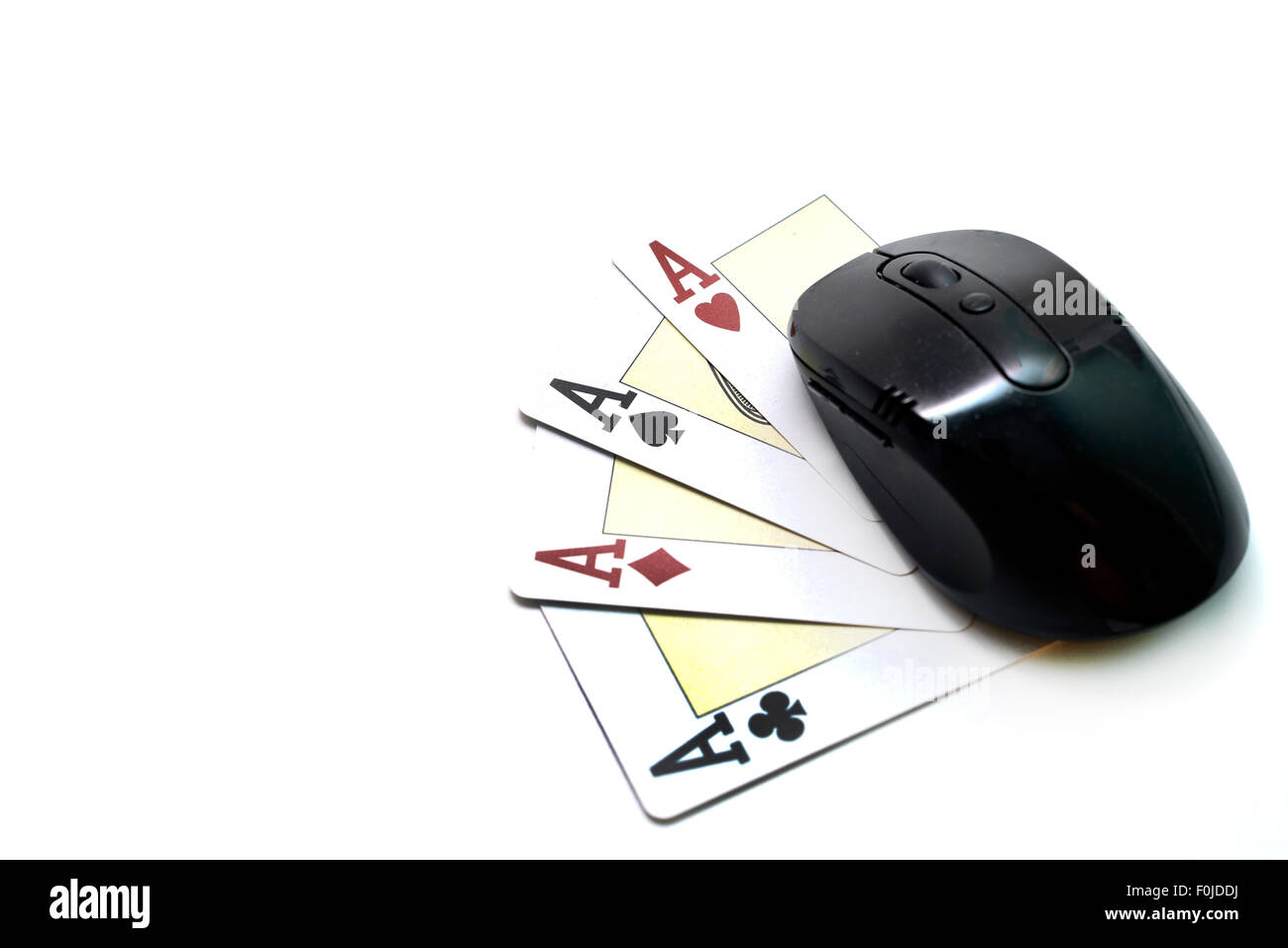 computer mouse and four card aces isolated over white background Stock ...
