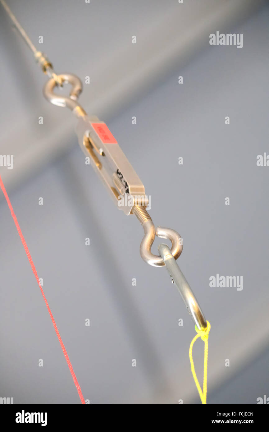 Cables and hook hanging from the Ceiling at the Construction site Stock ...