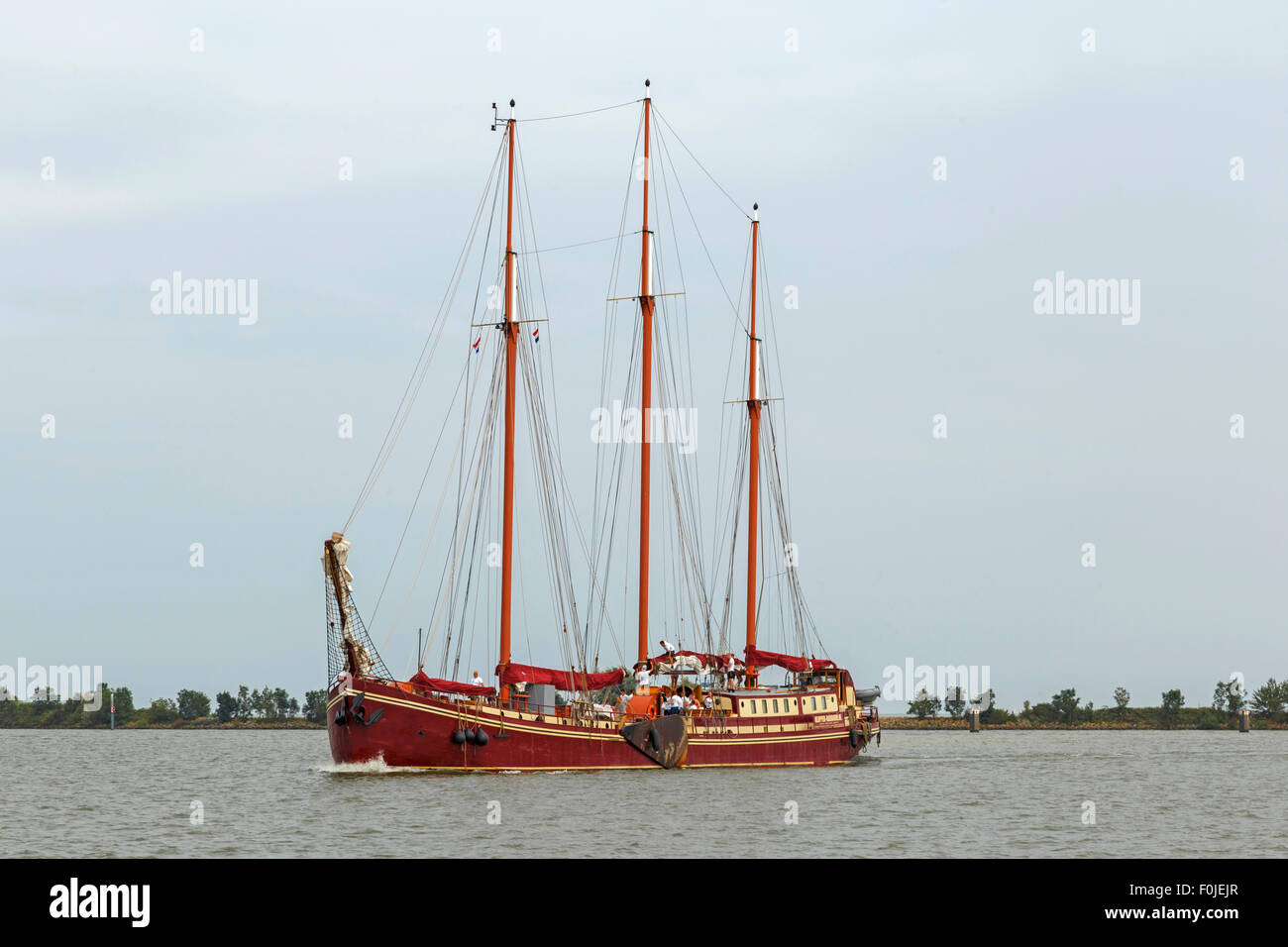 Old clipper sailing ship on the IJsselmeer, near the historic city of ...
