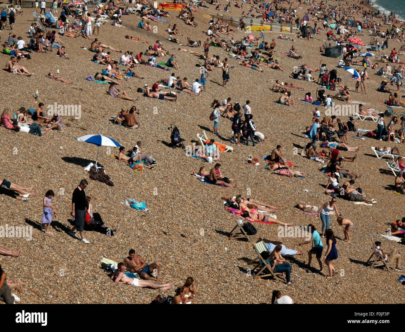 A busy day on the beach in sunny Brighton Stock Photo - Alamy
