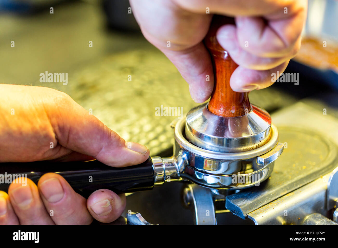 Espresso coffee making, coffee powder stamp Stock Photo - Alamy