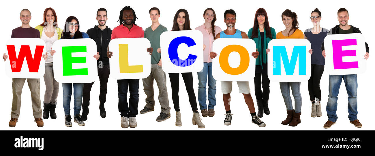 Smiling group of young multi ethnic people holding word welcome ...