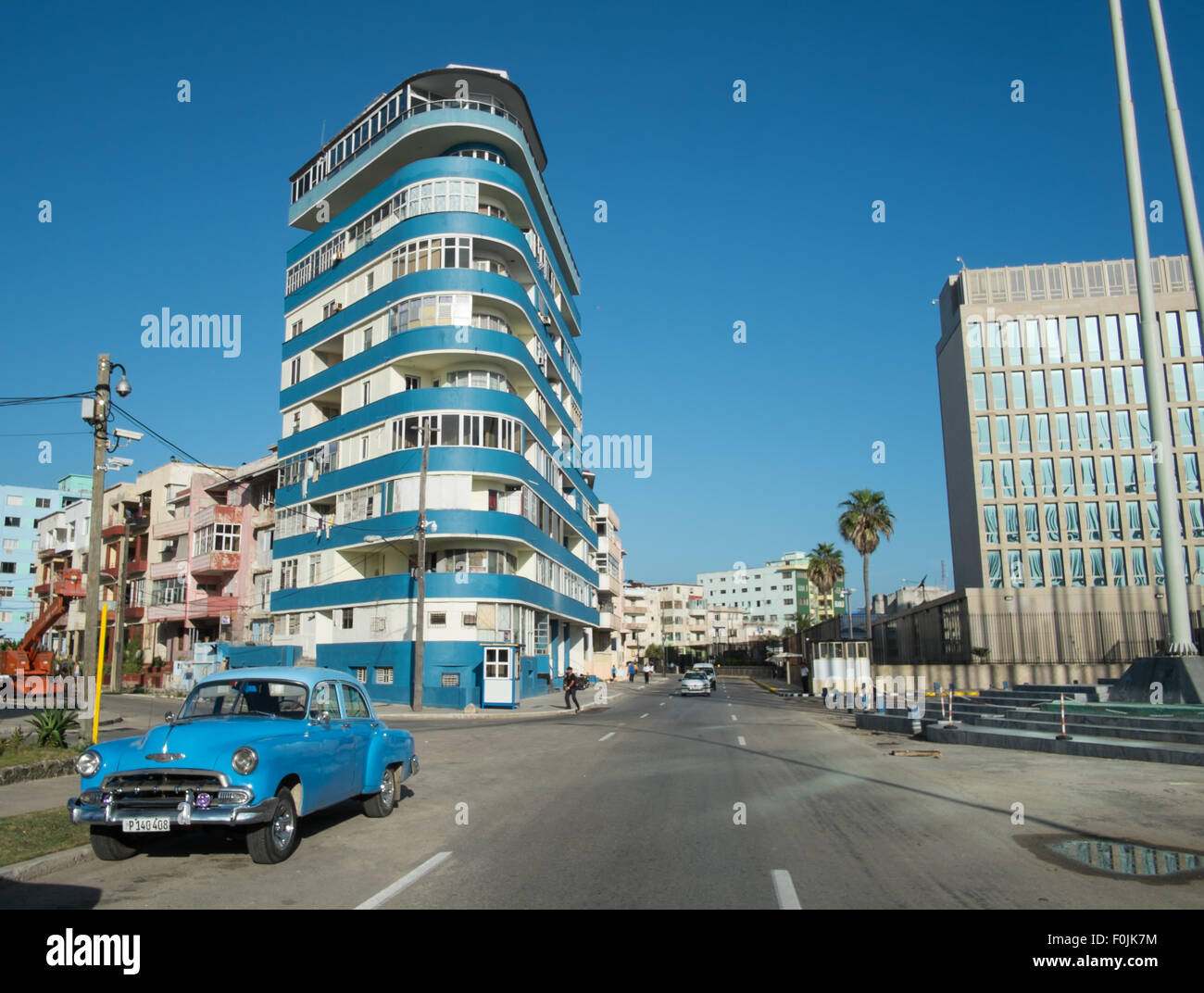Brightly coloured buildings and classic American made cars are one of ...
