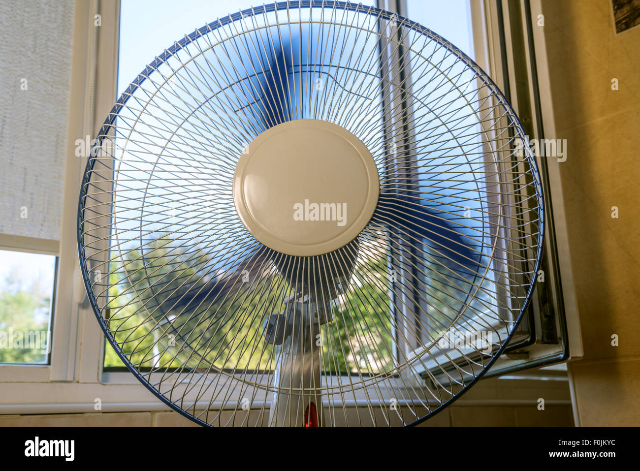 the fan is running near the open window Stock Photo - Alamy