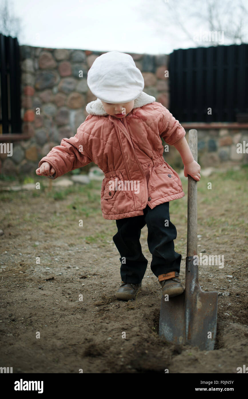 little boy digging a hole Stock Photo - Alamy