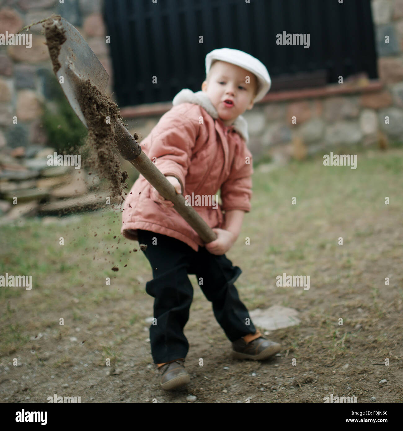 little boy digging a hole Stock Photo - Alamy