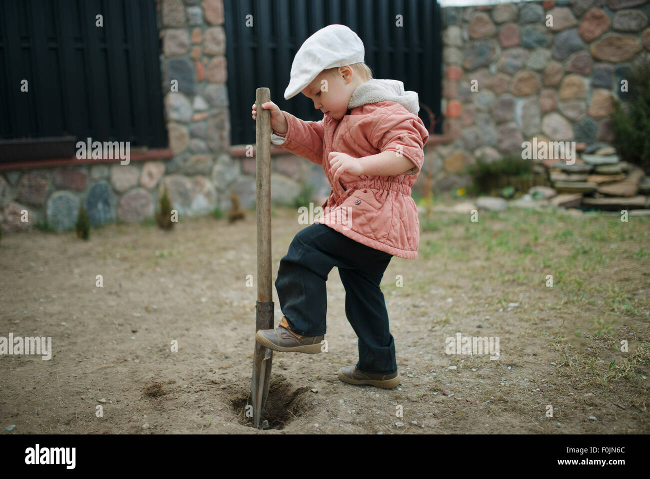 little boy digging a hole Stock Photo - Alamy
