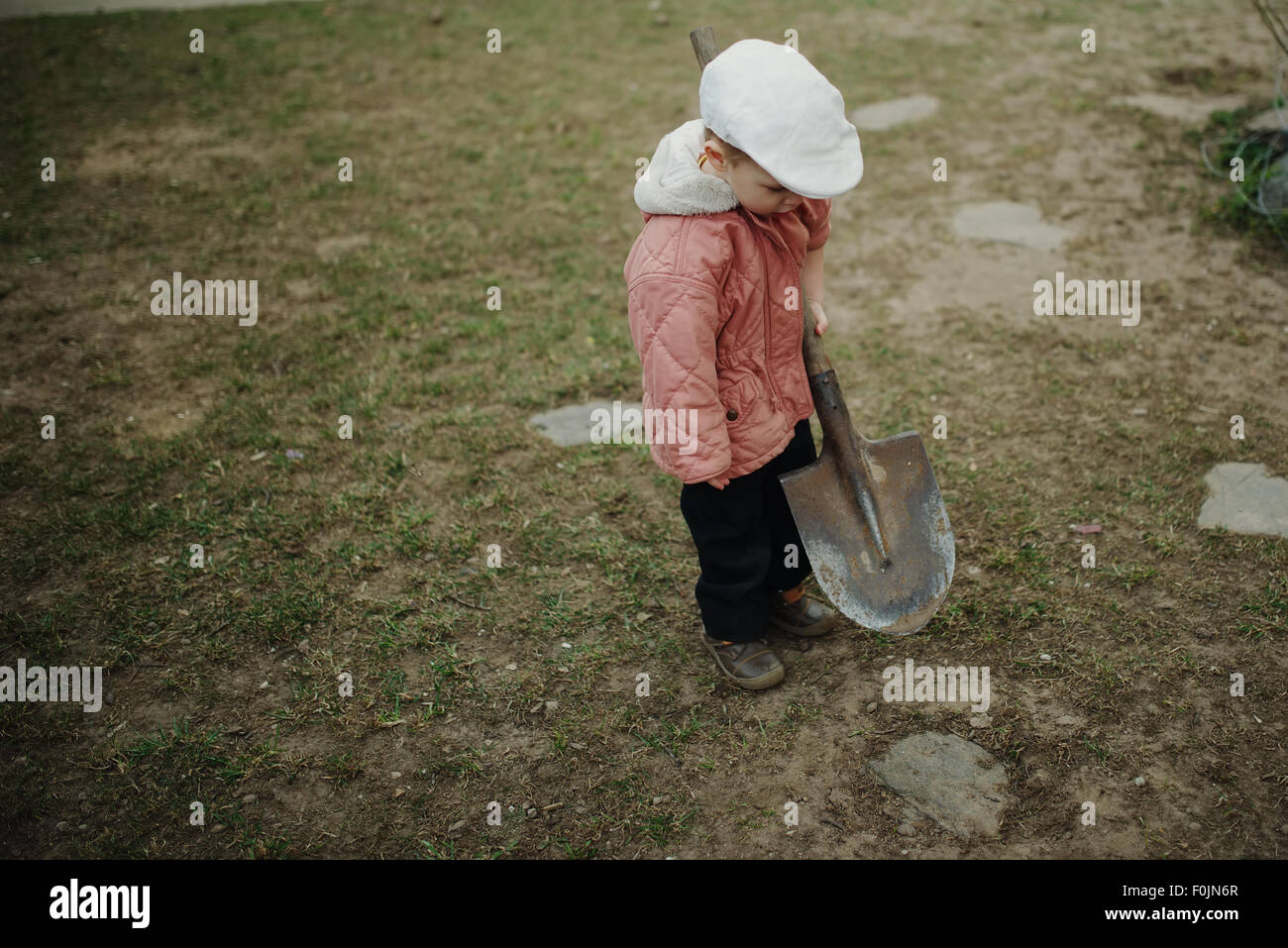 little boy digging a hole Stock Photo - Alamy