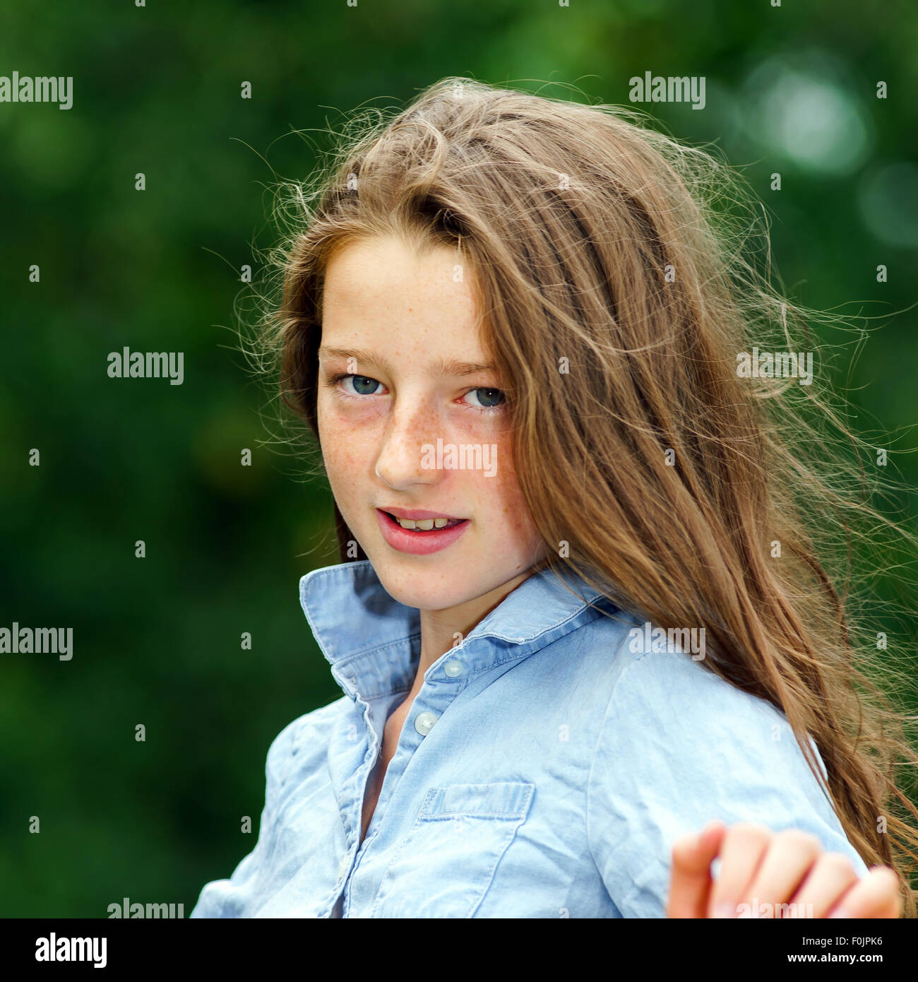 Moving into adulthood. Outdoor portrait of teenage frekled girl Stock ...