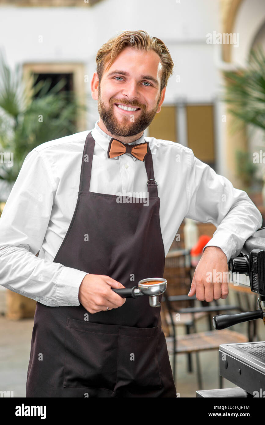 Positive young bearded male barista hi-res stock photography and images - Alamy