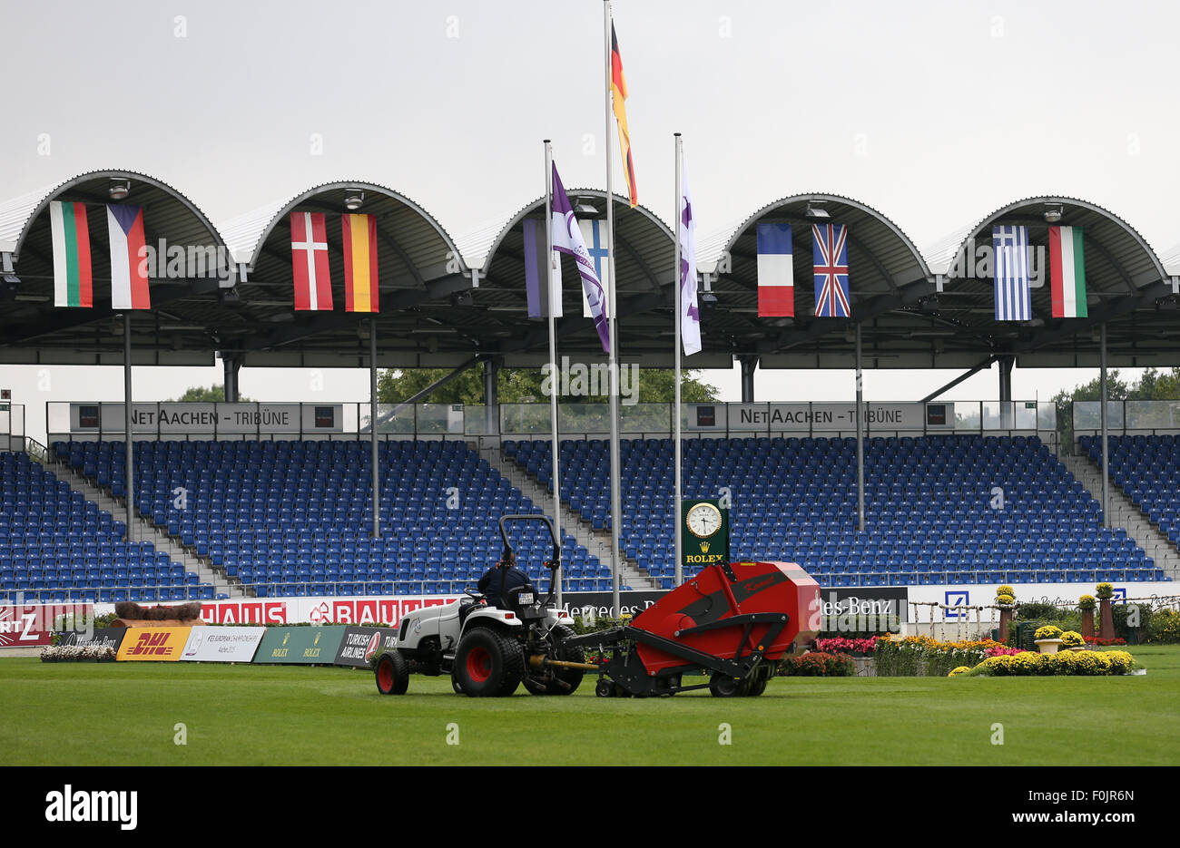 Aachen, Germany. 17th Aug, 2015. The riding arena is maintained prior ...