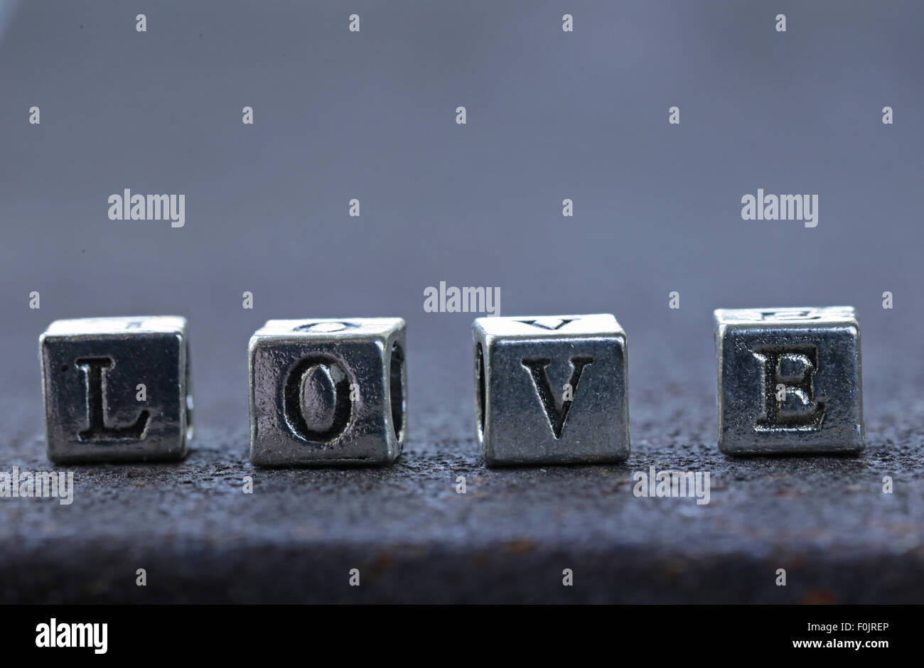 the word "LOVE" written in metal letters Stock Photo - Alamy