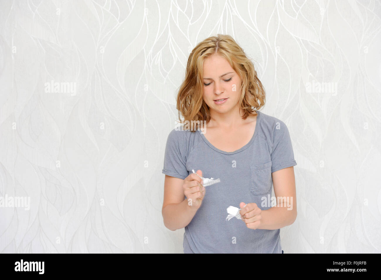 Angry young woman ripping papers Stock Photo - Alamy
