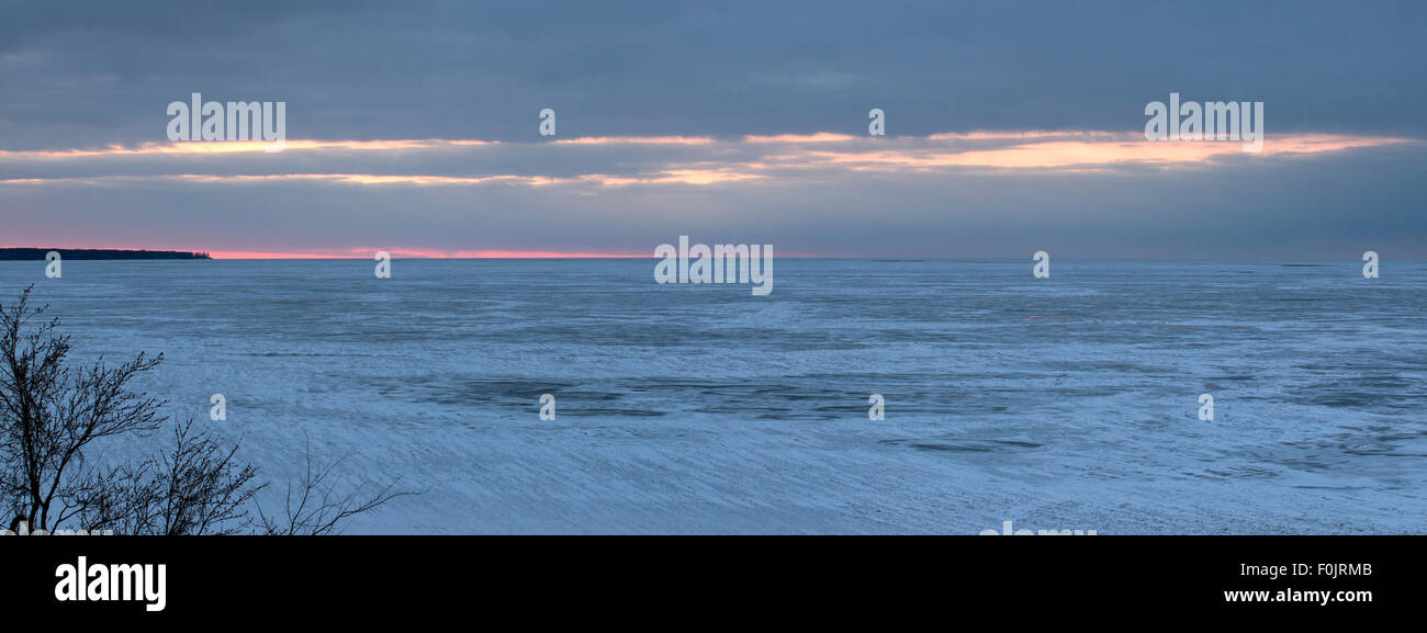 Ice covered lake at dusk Stock Photo - Alamy