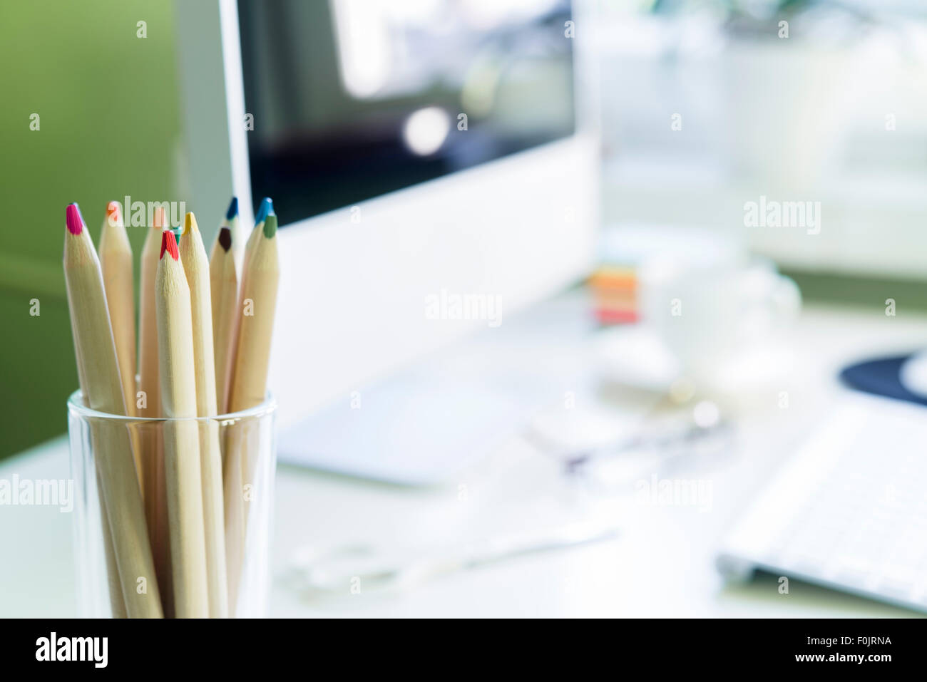Office workplace with computer on white table. Focus on pencils Stock ...